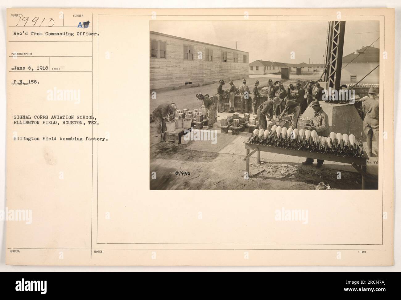 Soldiers at Ellington Field in Houston, Texas work at a bombing factory during World War One ...