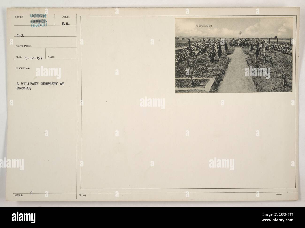 Army personnel standing in formation at the military cemetery in Ercheu ...