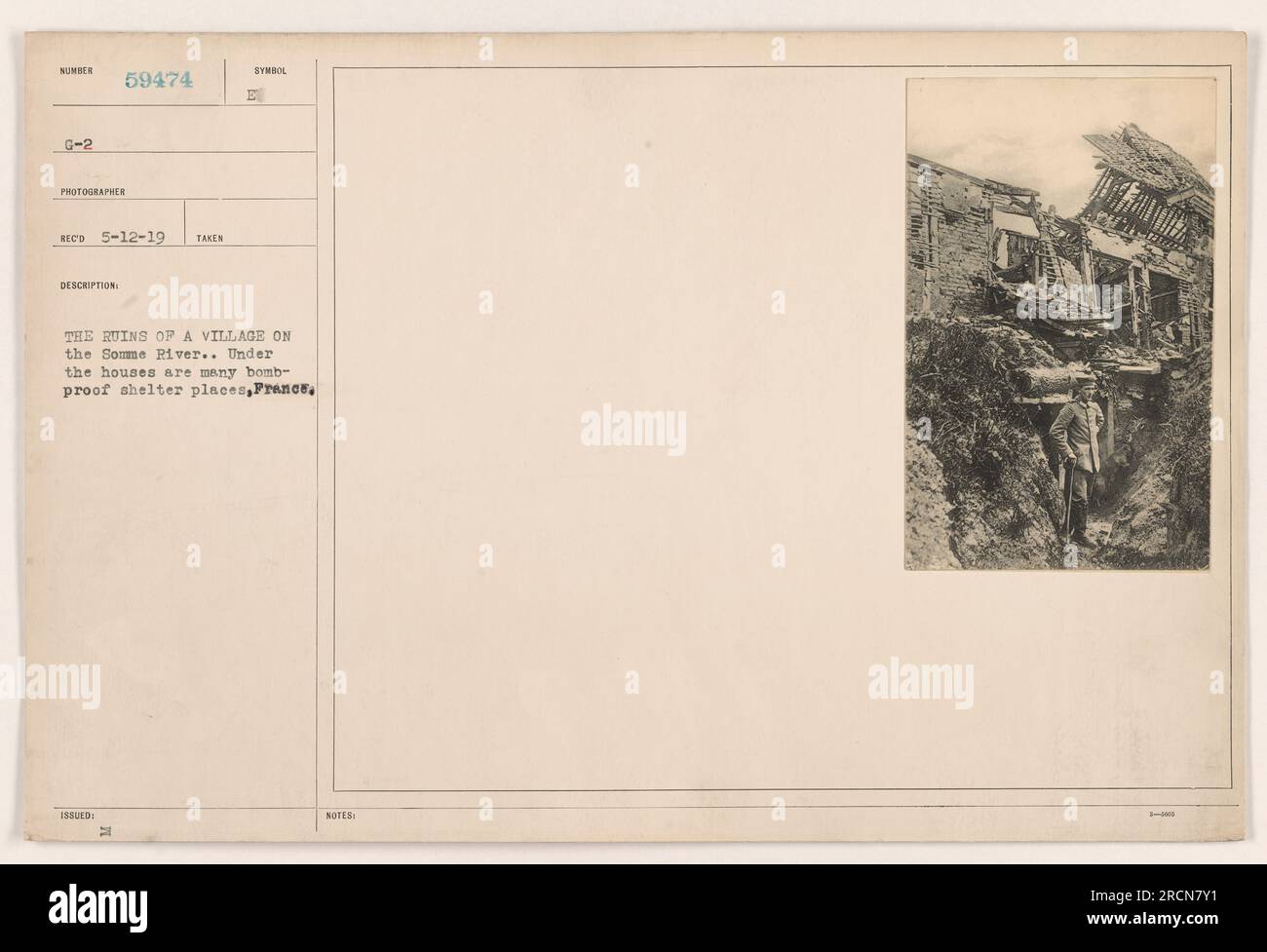 The photograph depicts the ruins of a village on the Somme River during ...