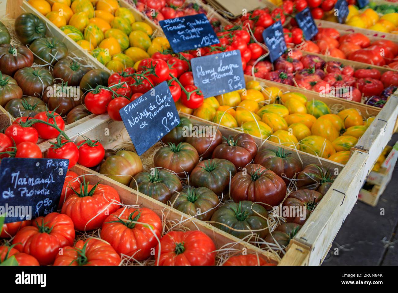 Fresh ripe beefsteak tomatoes with a price tag of 8.9 EUR a kilo at a ...