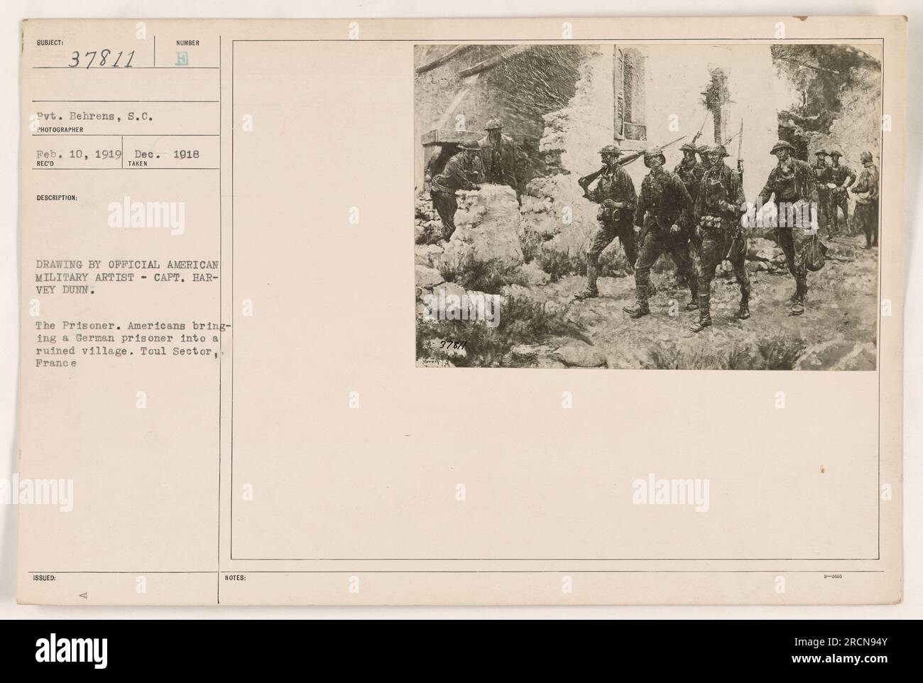 American soldiers escorting a German prisoner into a destroyed village ...