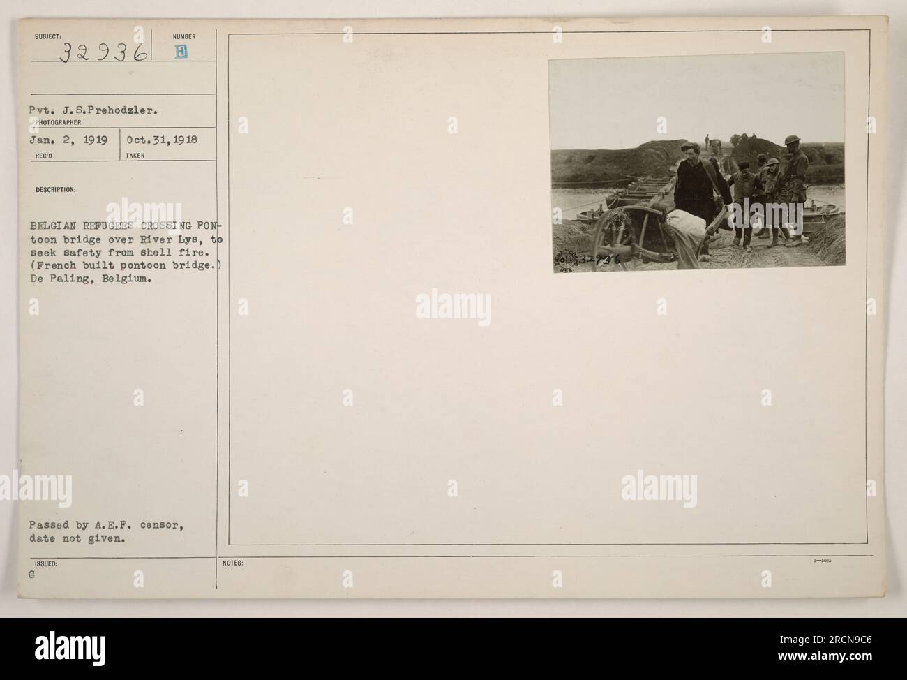 Belgian refugees crossing a pontoon bridge over the River Lys to escape ...