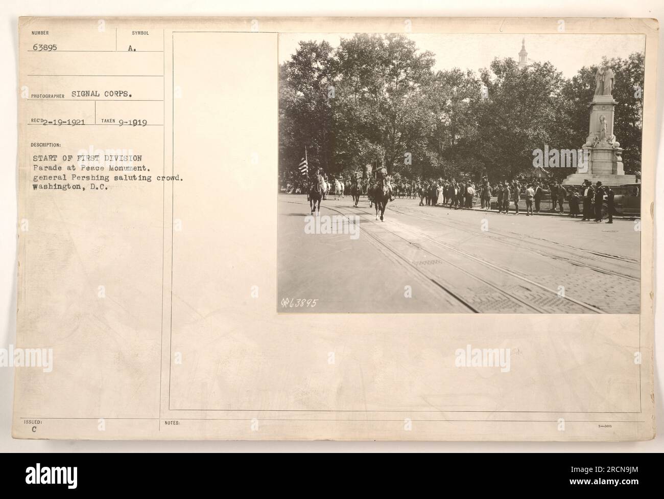 General Pershing saluting the crowd at the start of a First Division ...