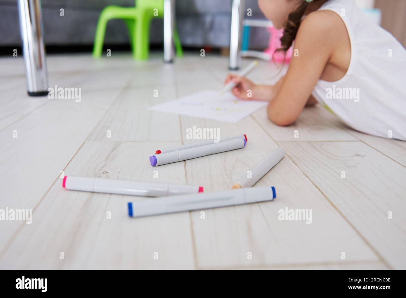 Selective focus on felt-tip-pens or watercolor markers on floor on the ... Selective focus on felt-tip-pens or watercolor markers on floor on the ...