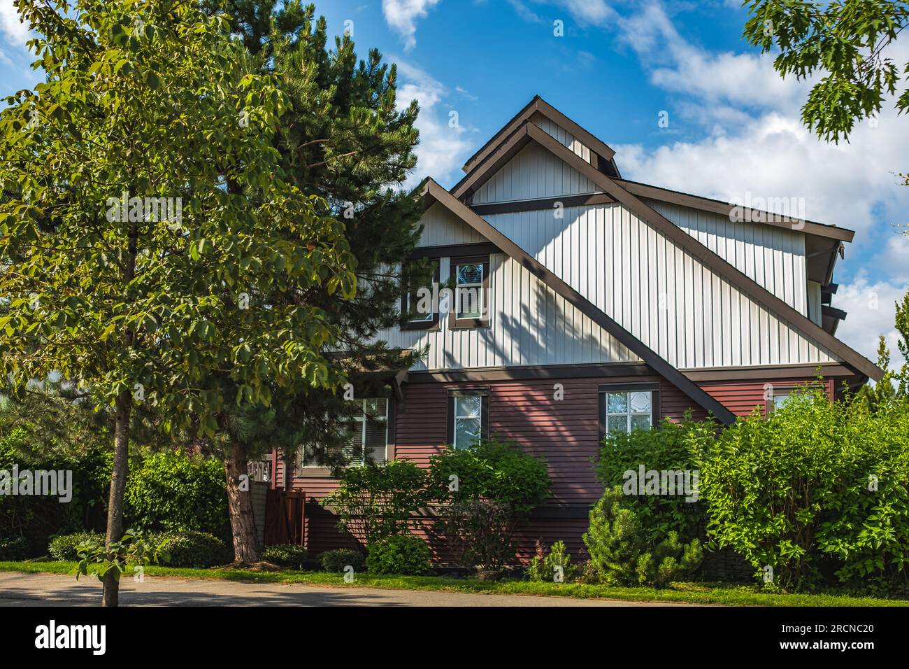 Real Estate Exterior Front House on a sunny day. Big custom made luxury ...