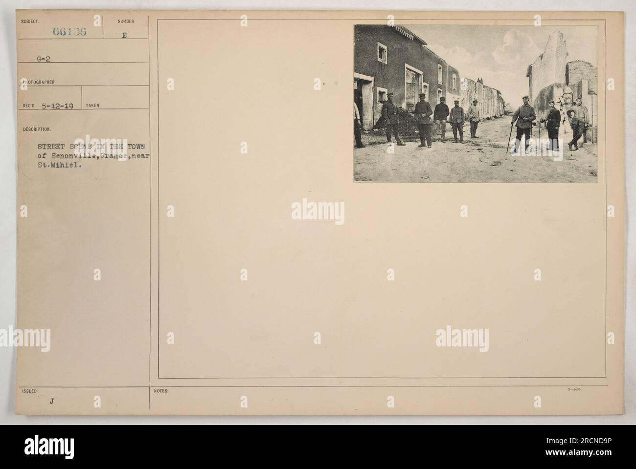 Soldiers and local civilians mingle on the streets of Senonville ...