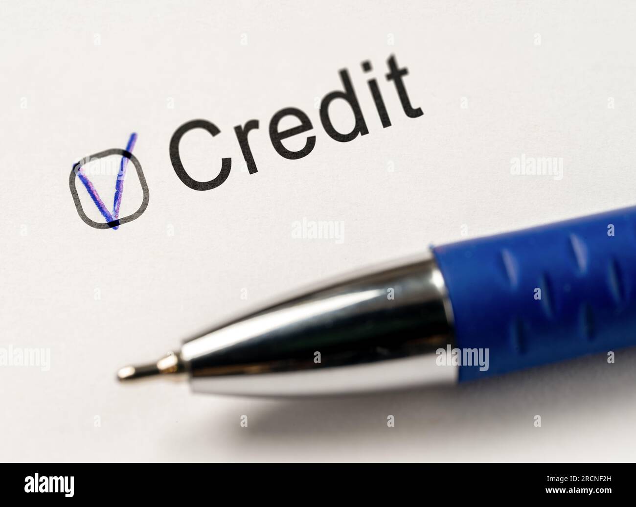 Credit checkbox with tick on white paper with pen. loan approval ...