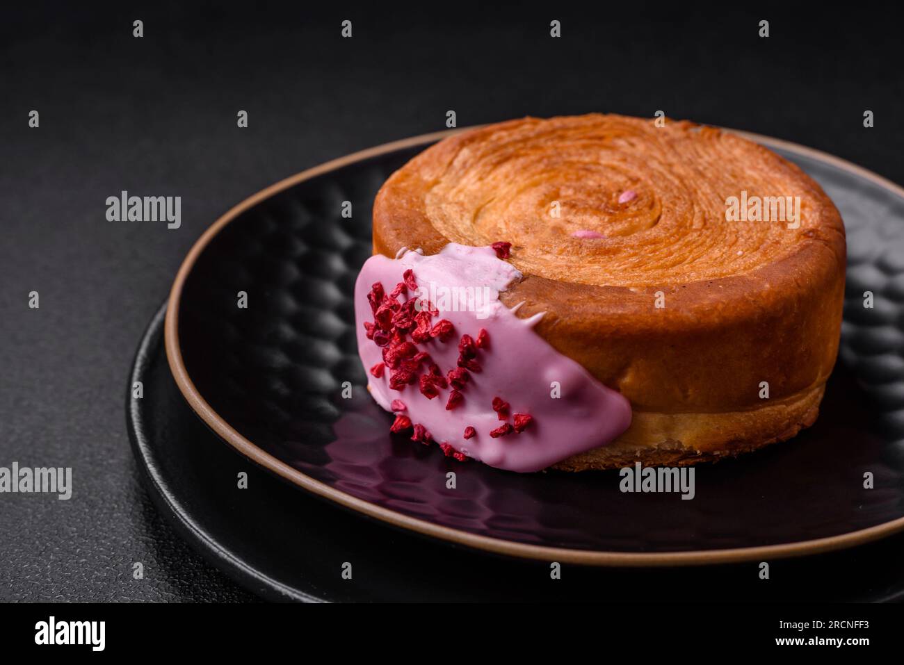 Round puff pastry croissant with raspberry filling or new york roll on ...