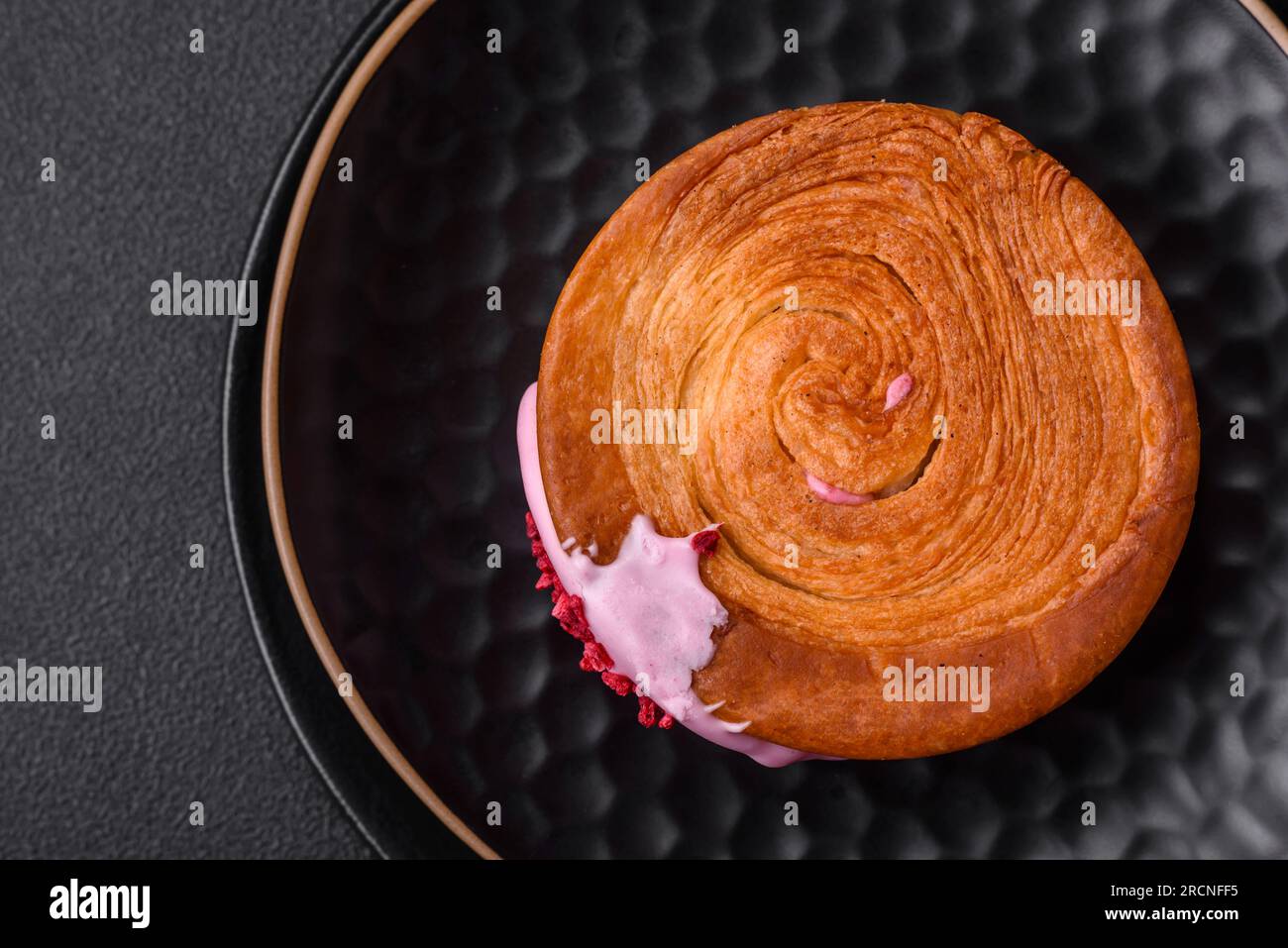 Round puff pastry croissant with raspberry filling or new york roll on ...