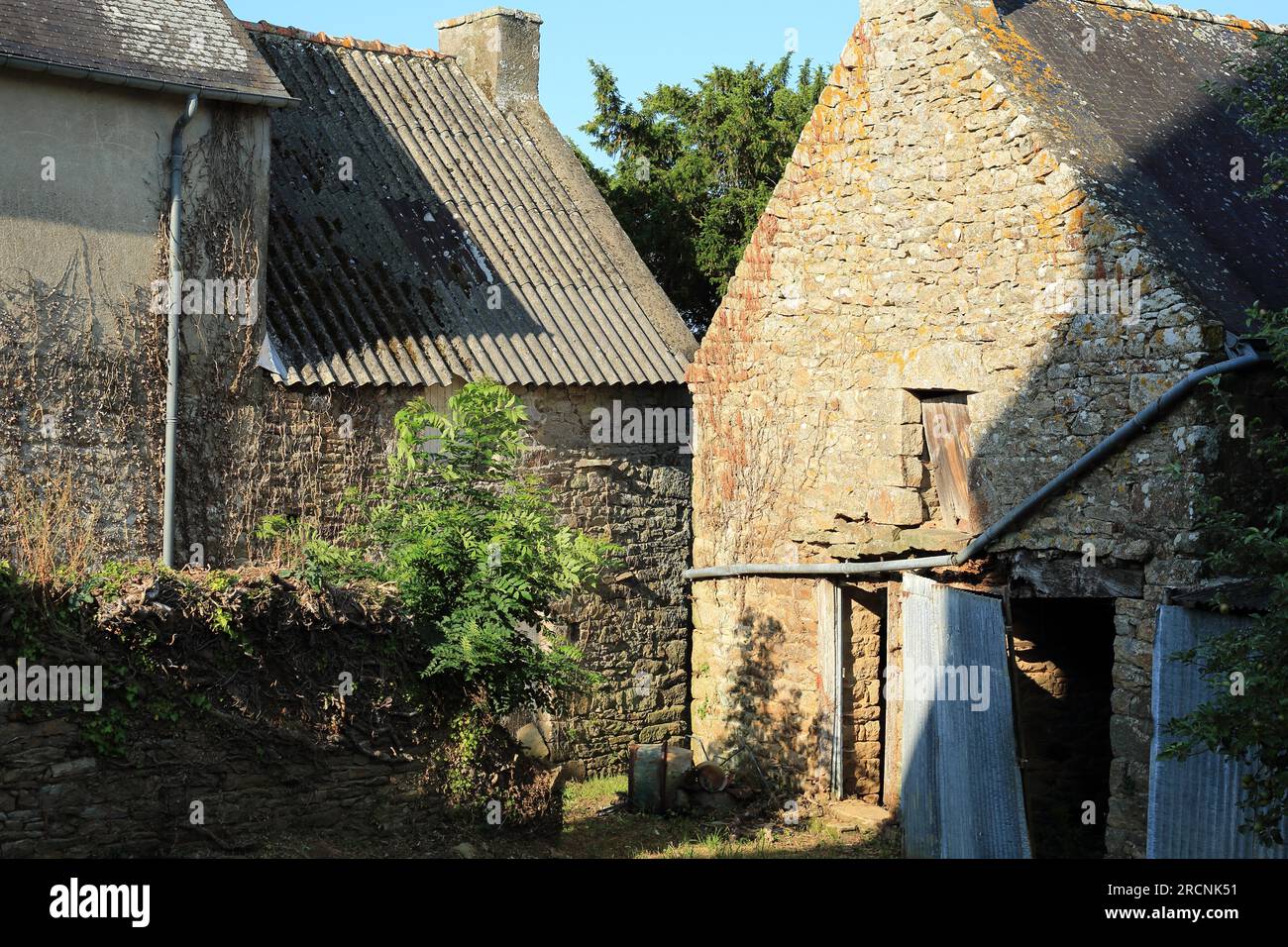 Stone farm buildings in the centre of the village from Place du ...