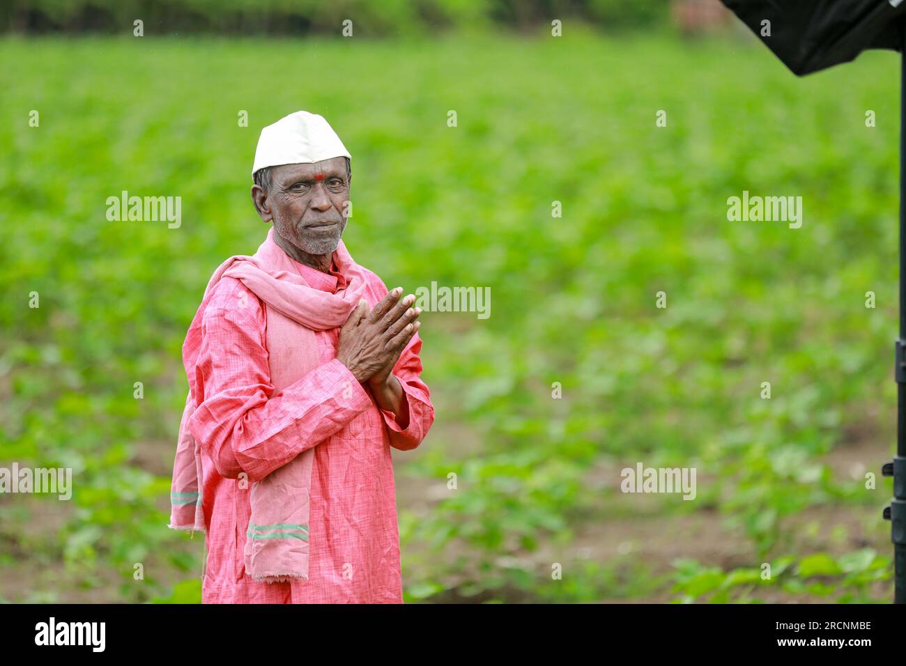Indian happy farm worker , working in farm Stock Photo - Alamy
