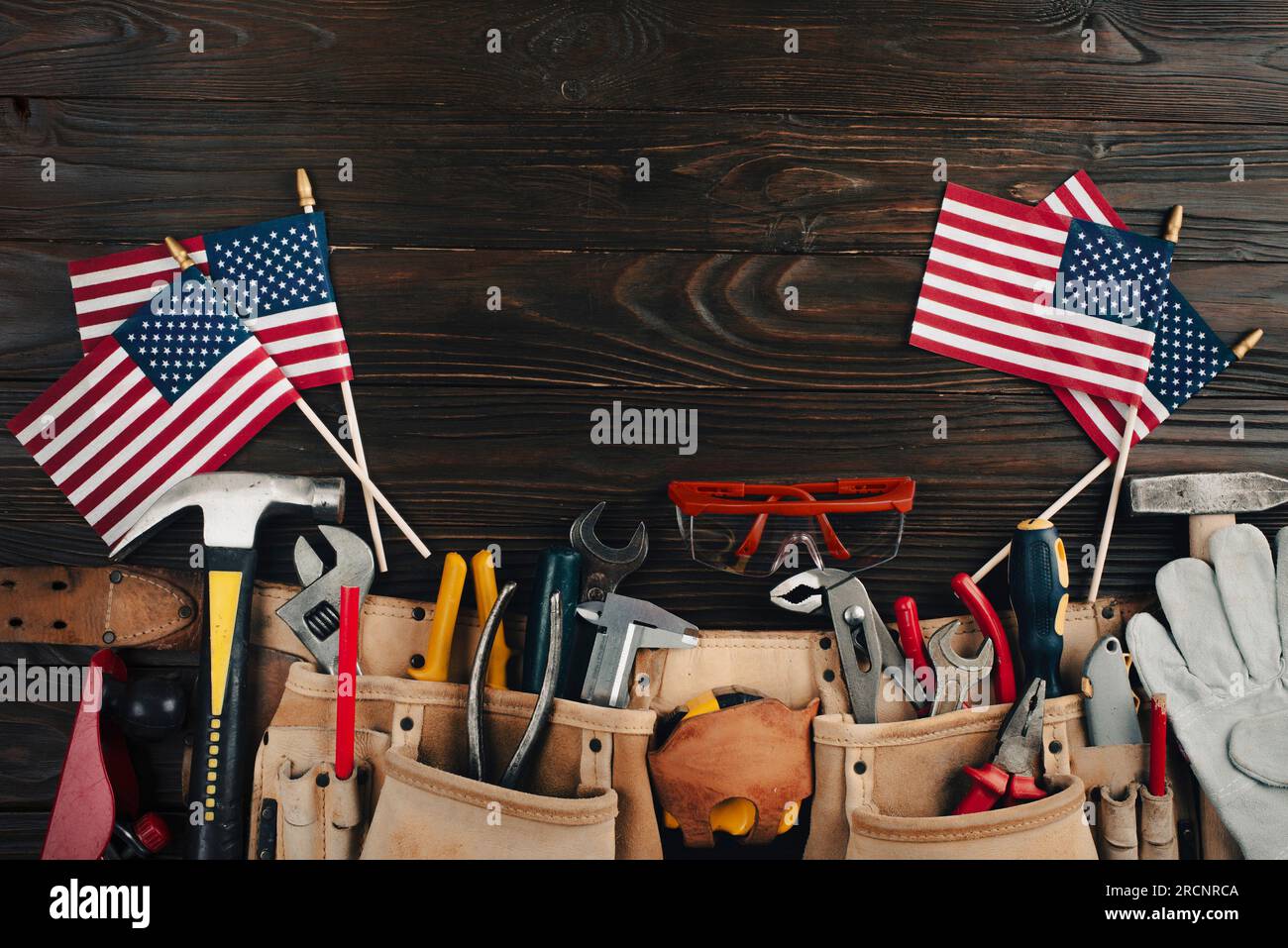 Labor day banner mockup of tools toolbelt and us flag on wooden ...