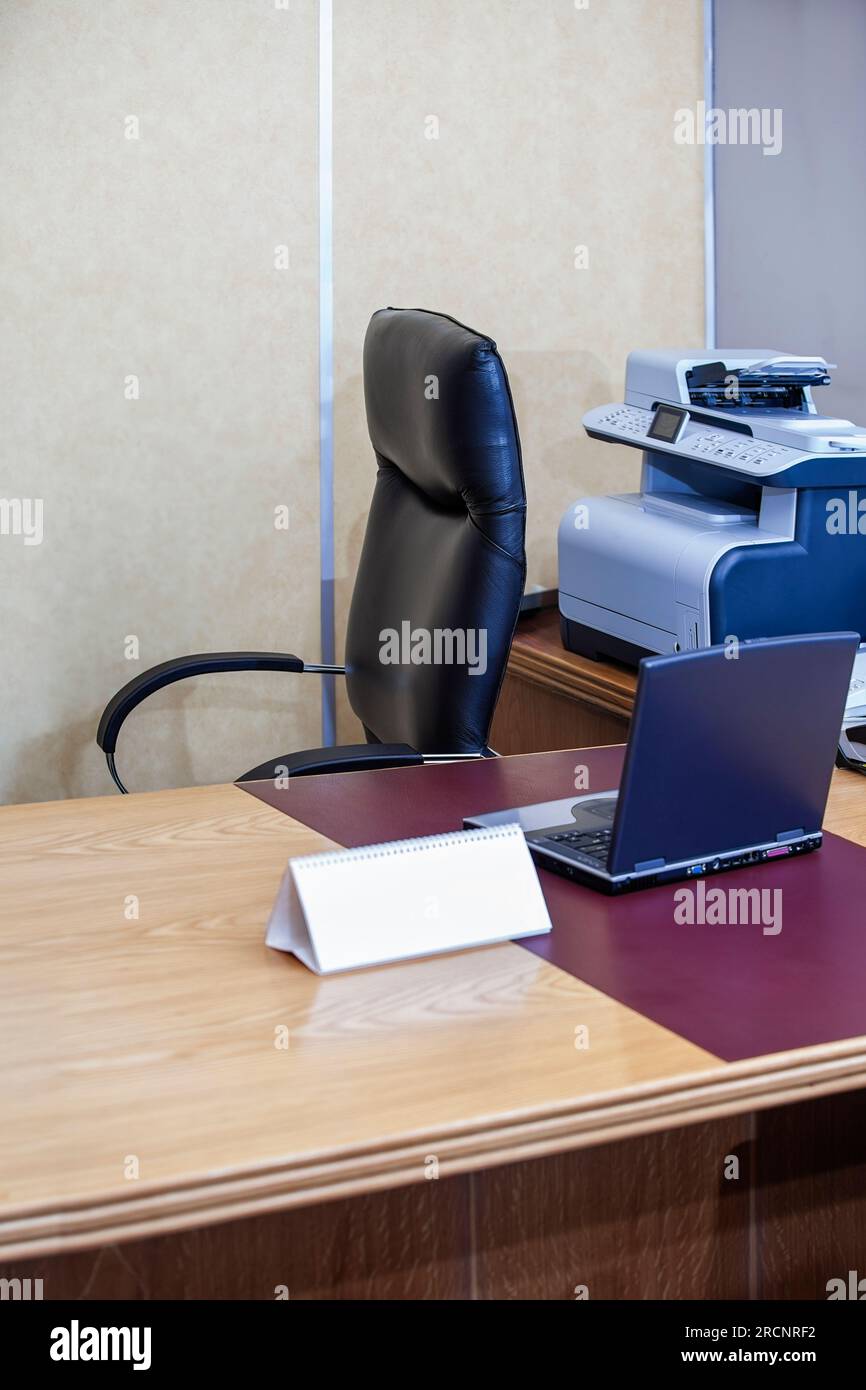 modern office interior with desk and chair, multifunction printer with ...