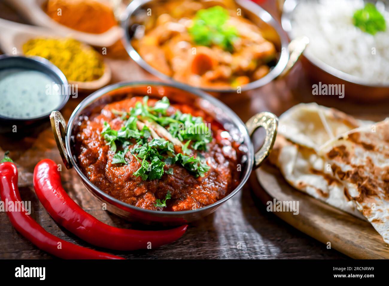 Hot madras paneer and vegetable masala with basmati rice served in ...
