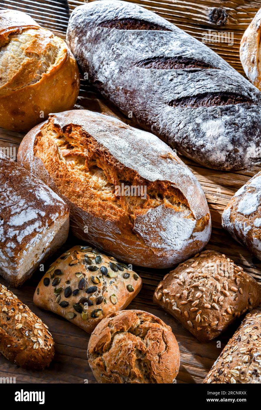 Assorted bakery products including loaves of bread and rolls Stock ...