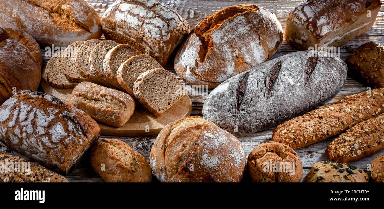 Assorted bakery products including loaves of bread and rolls Stock ...