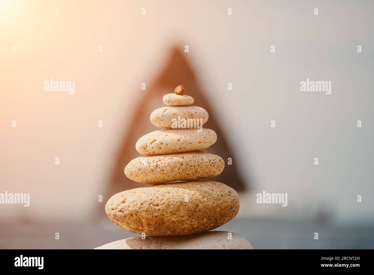 Balanced rock pyramid on sea pebbles beach, sunny day and clear sky at ...