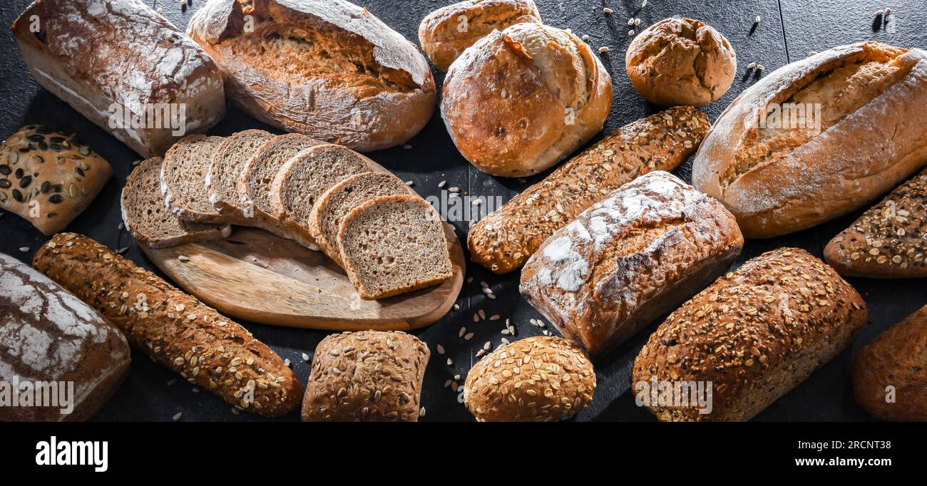 Assorted bakery products including loaves of bread and rolls Stock ...