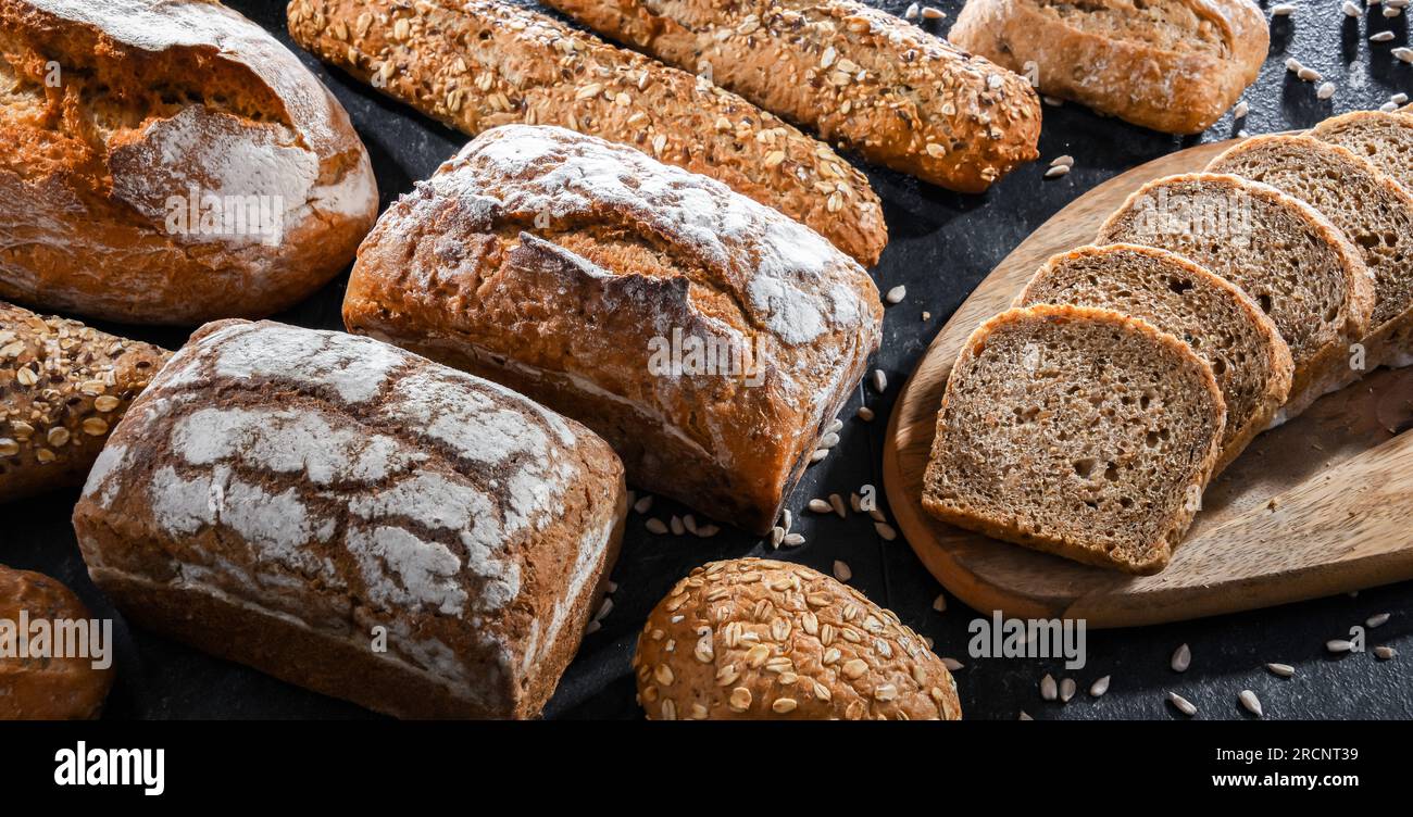 Assorted bakery products including loaves of bread and rolls Stock ...
