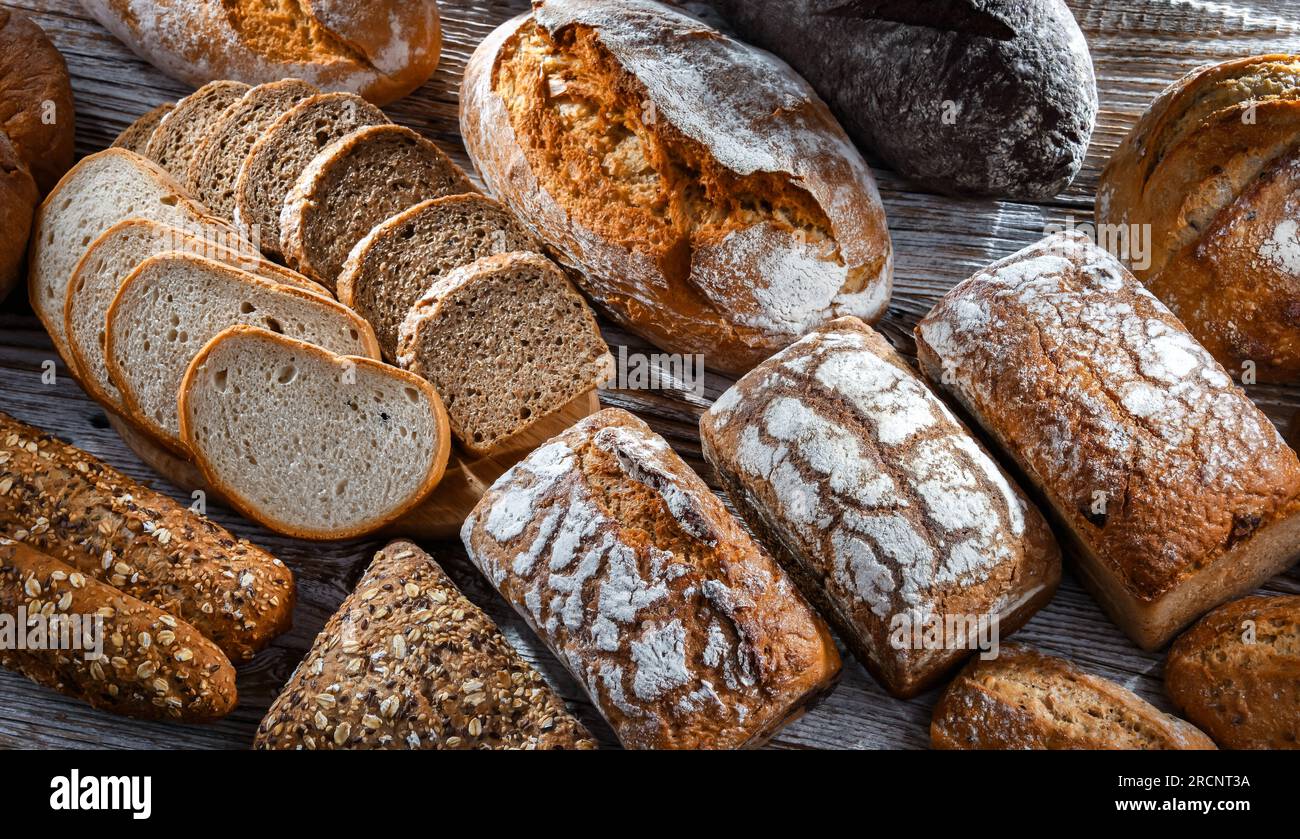 Assorted bakery products including loaves of bread and rolls Stock ...