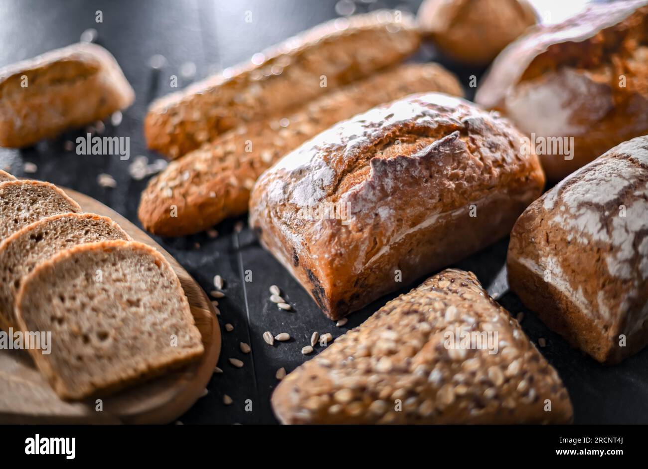 Assorted bakery products including loaves of bread and rolls Stock ...