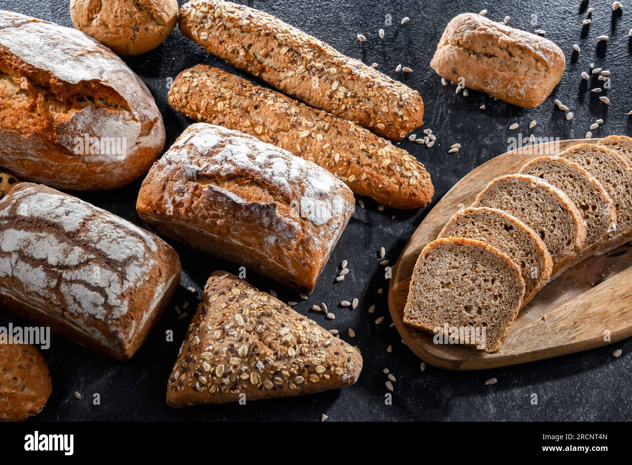Assorted bakery products including loaves of bread and rolls Stock ...