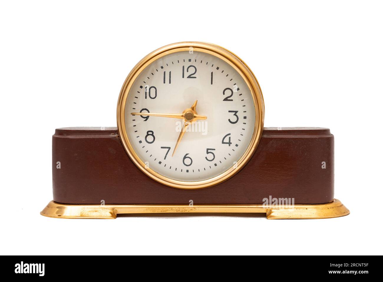 Vintage mechanical table clock isolated on white Stock Photo - Alamy