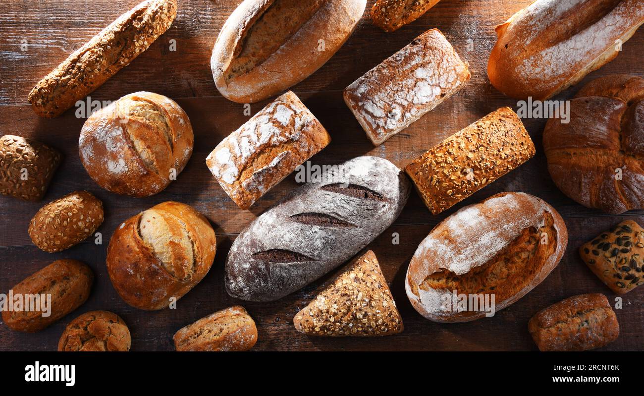 Assorted bakery products including loaves of bread and rolls Stock ...