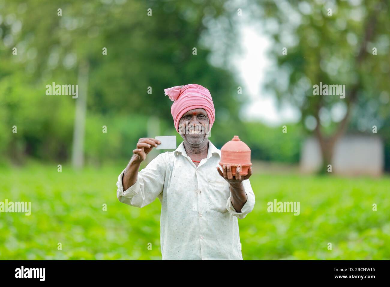 Indian farmer Holding ATM card in hands , happy indian farmer, poor ...