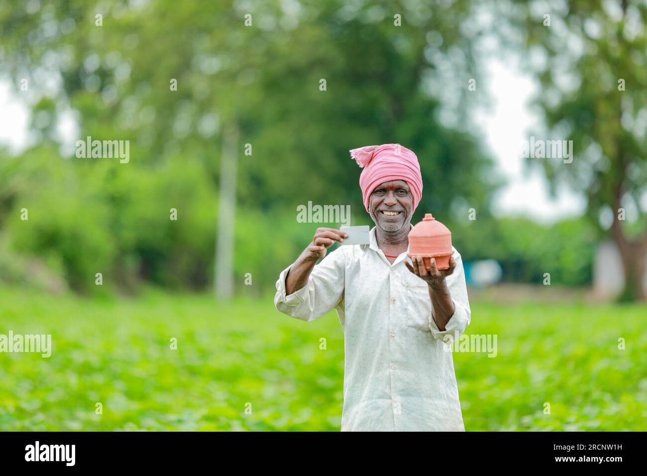 Indian farmer Holding ATM card in hands , happy indian farmer, poor ...