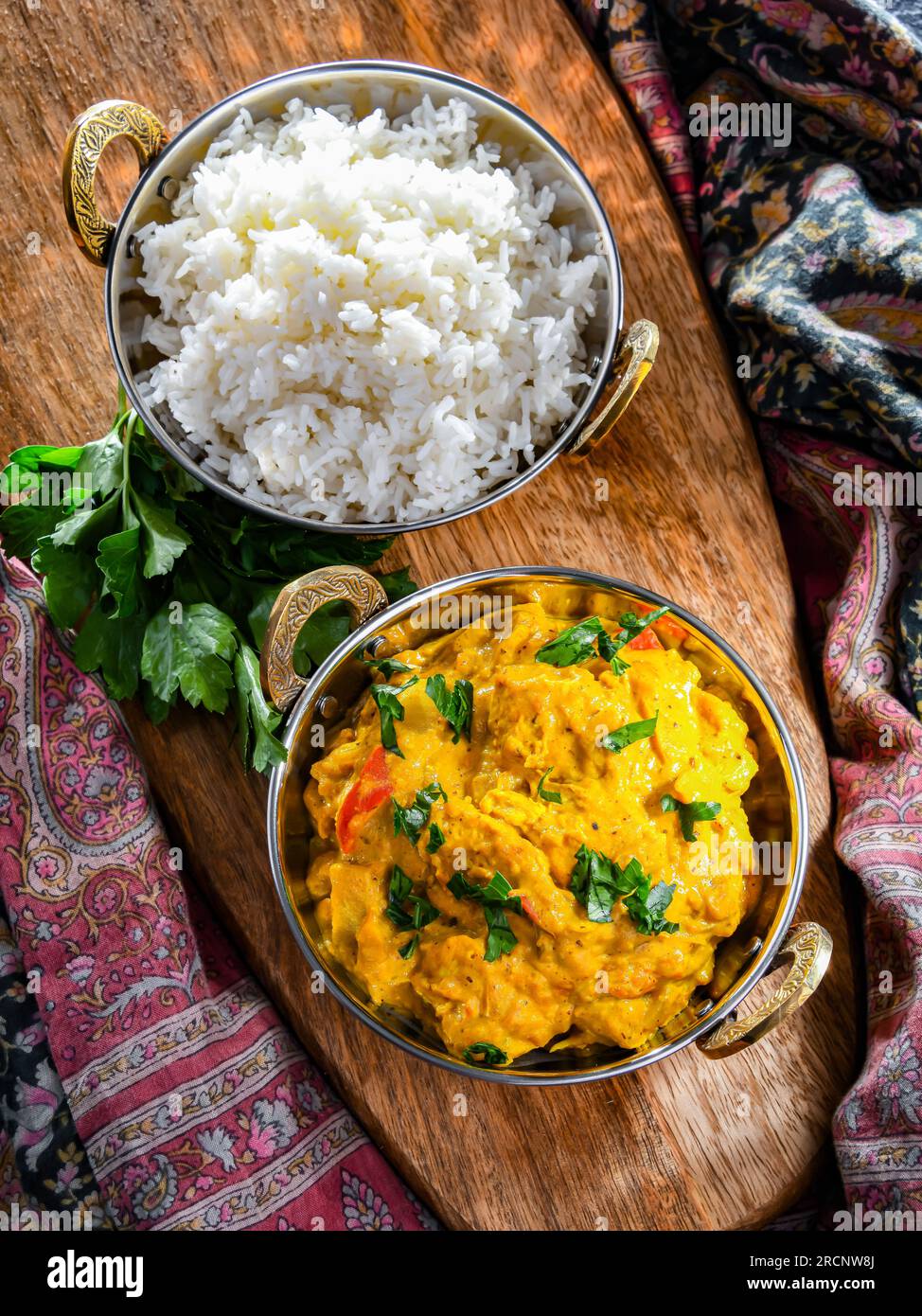 Curry chicken with rice served in original indian karahi pots Stock ...