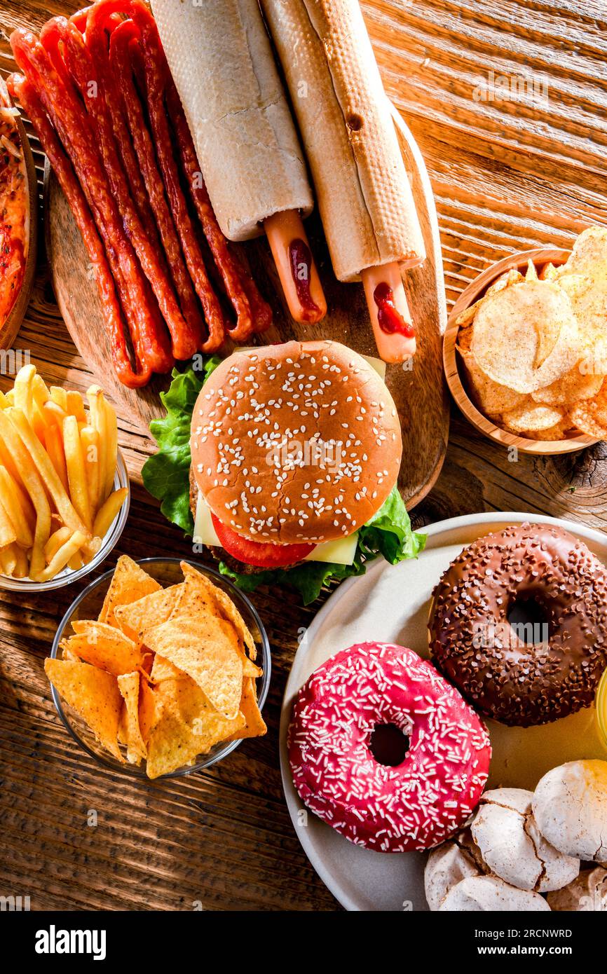 Foods enhancing the risk of cancer. Junk food Stock Photo - Alamy