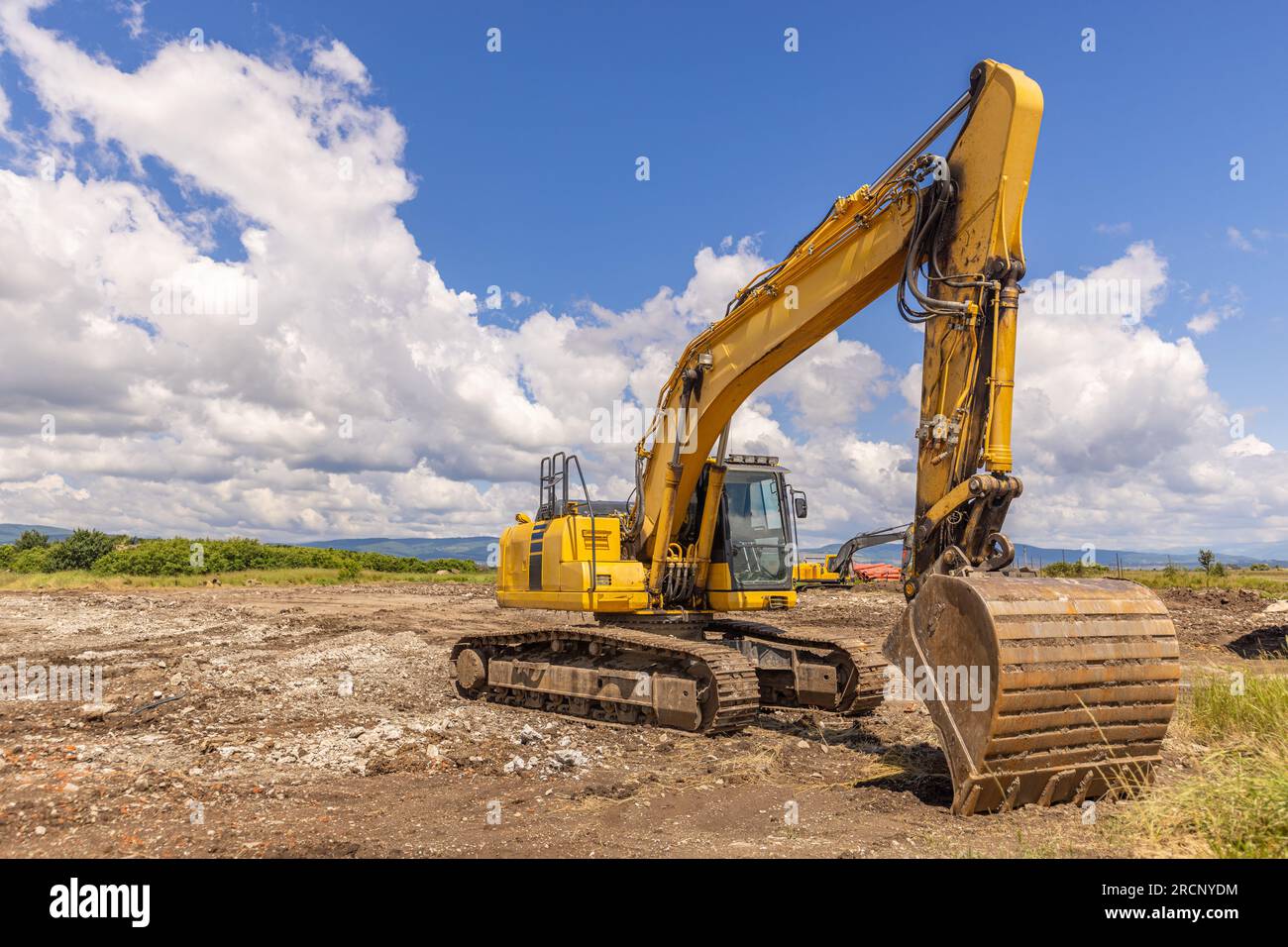 Excavator in construction site. Industrial excavator parked up on ...