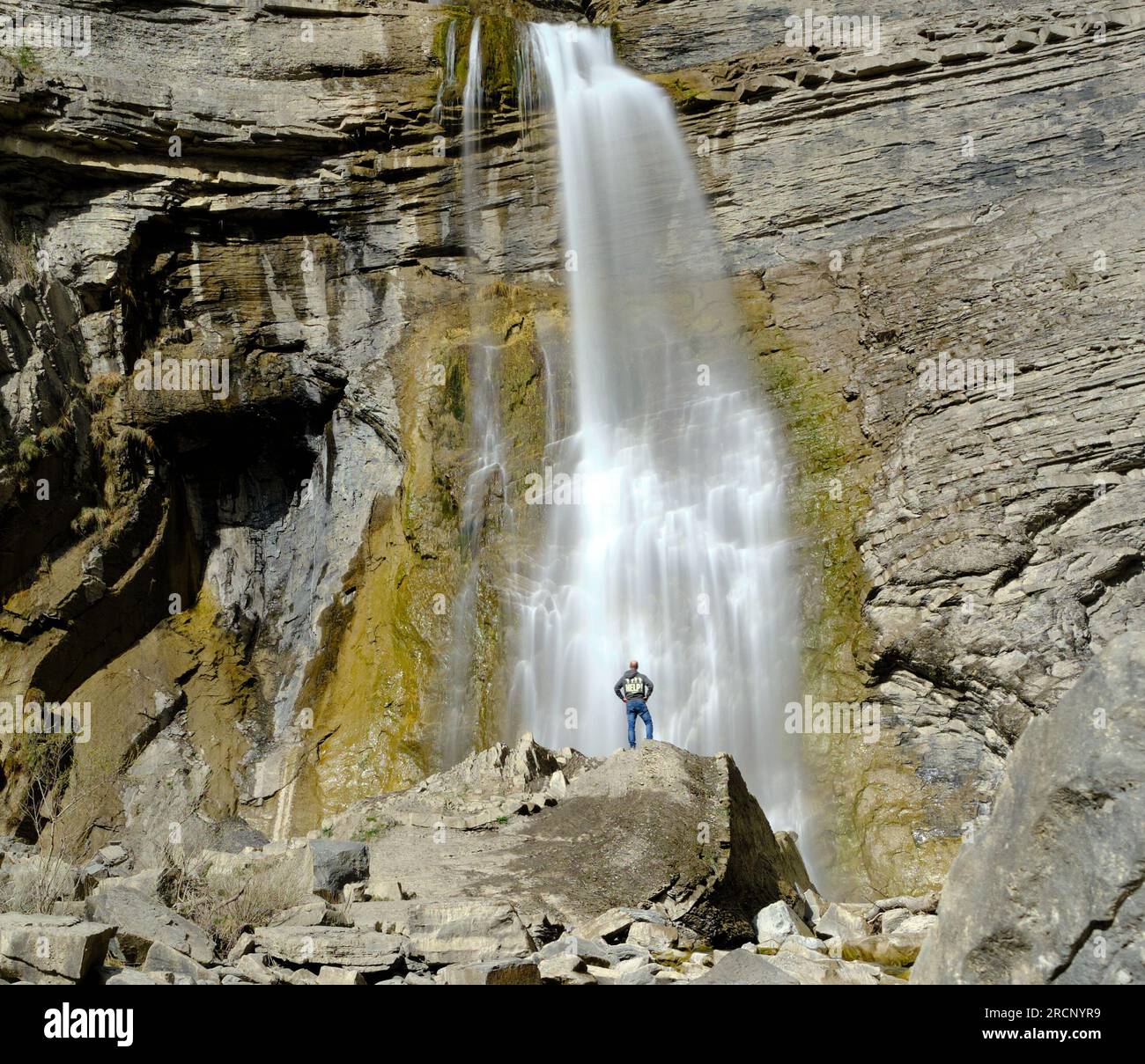 high mountain landscape in which waterfalls are seen through which a ...