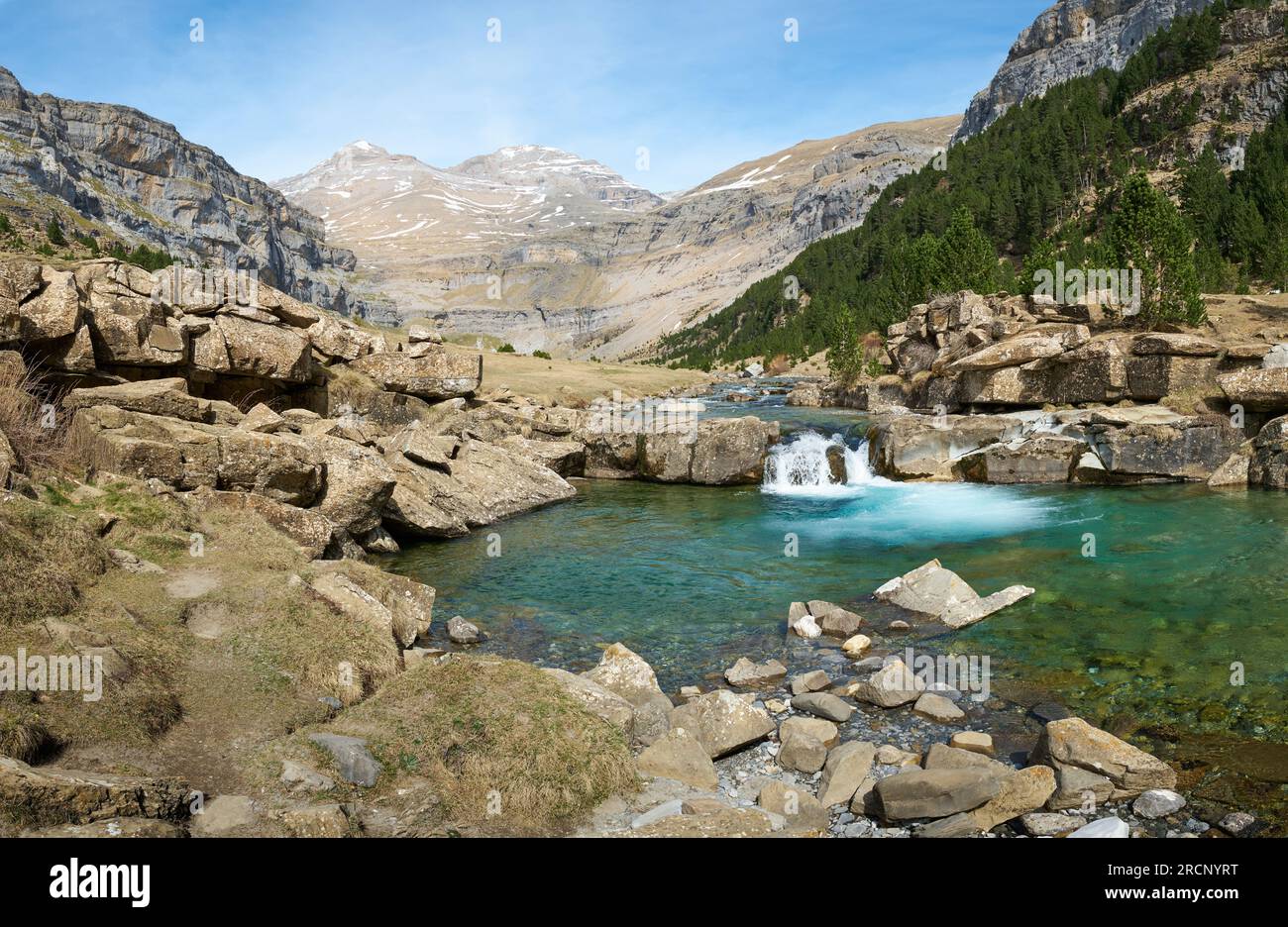 high mountain landscape in which waterfalls are seen through which a ...