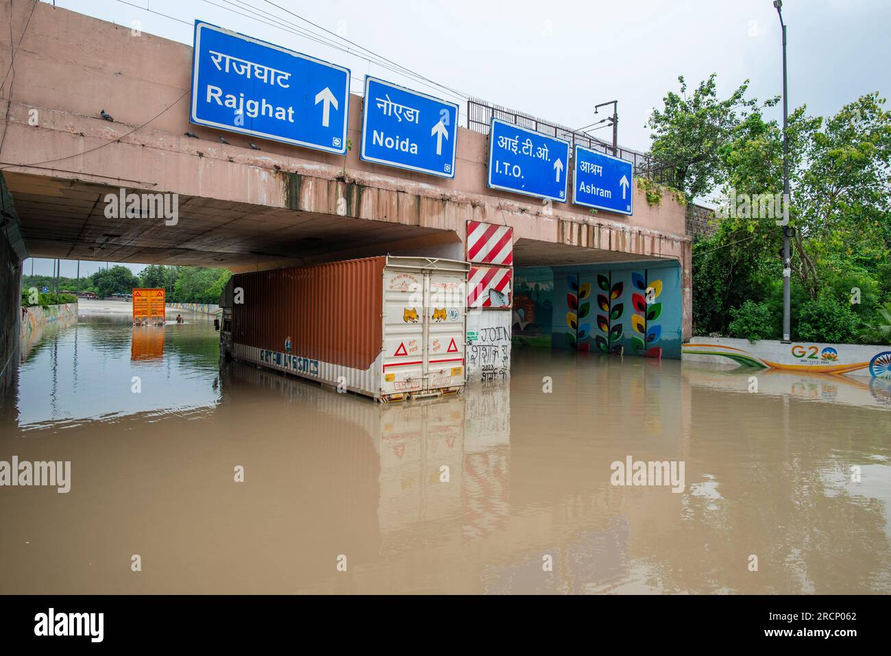 New Delhi, India. 15th July, 2023. Vehicles stuck in a flooded ...