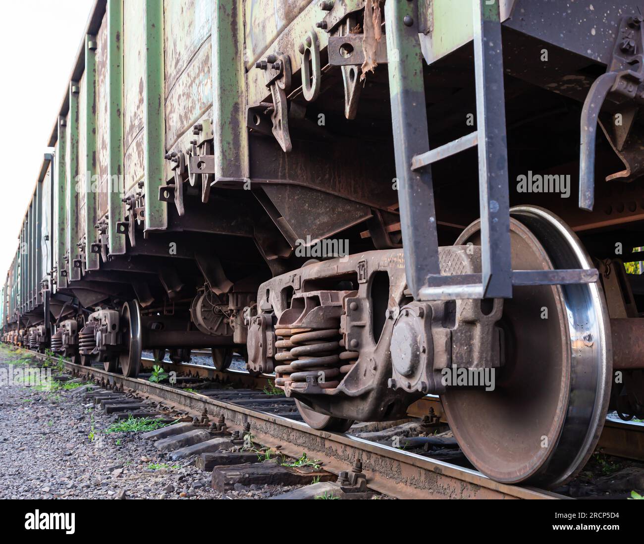 Old rusty railway cars stand on the tracks of the station Stock Photo ...