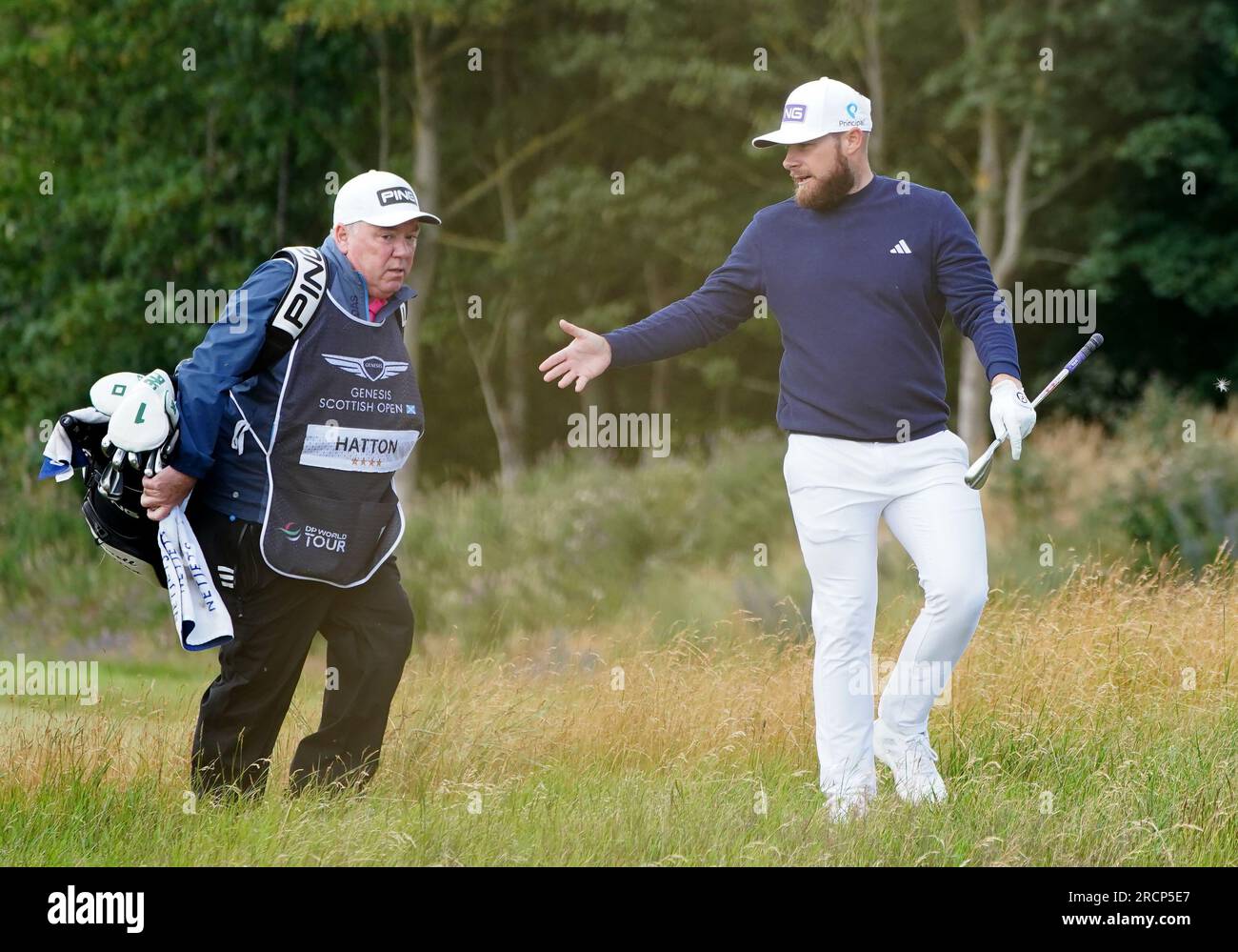 Tyrrell Hatton (right) talks to his caddy on the 10th on day four of ...