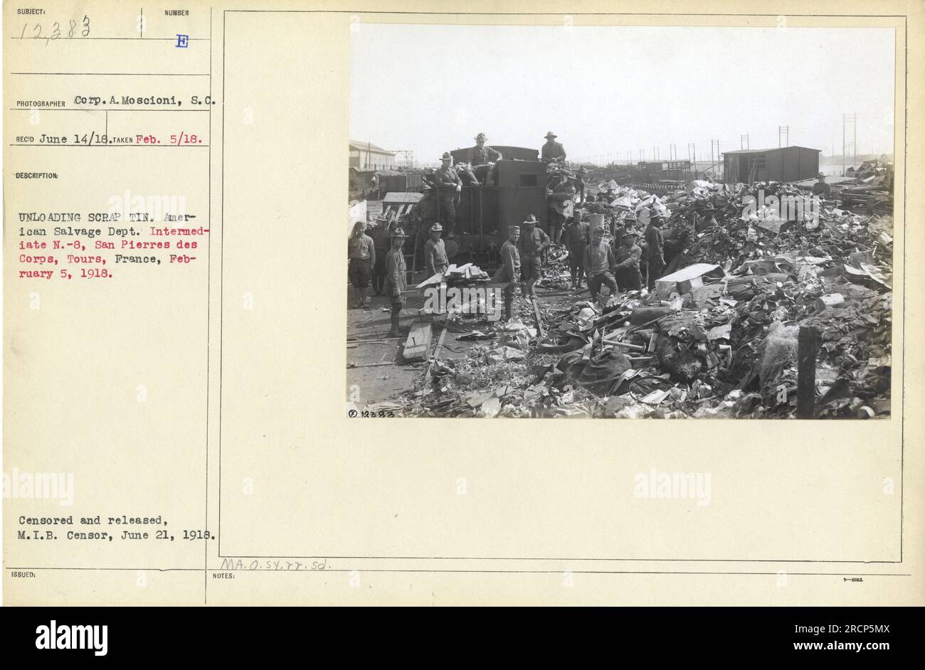 American soldiers unloading scrap tin in San Pierres des Corps, France ...