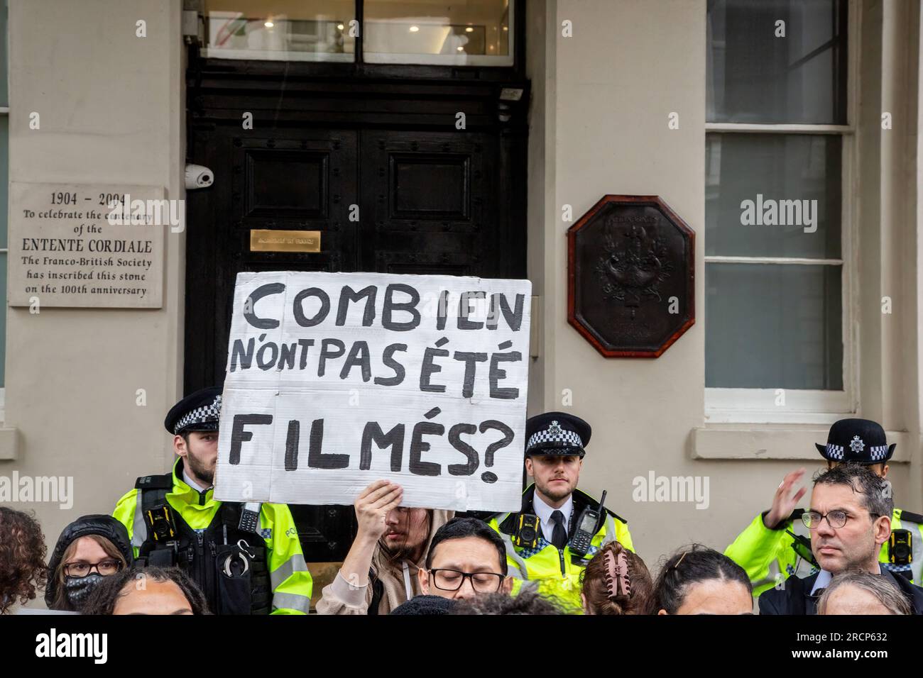 London, UK. 14th July, 2023. A protester holds a placard outside the ...