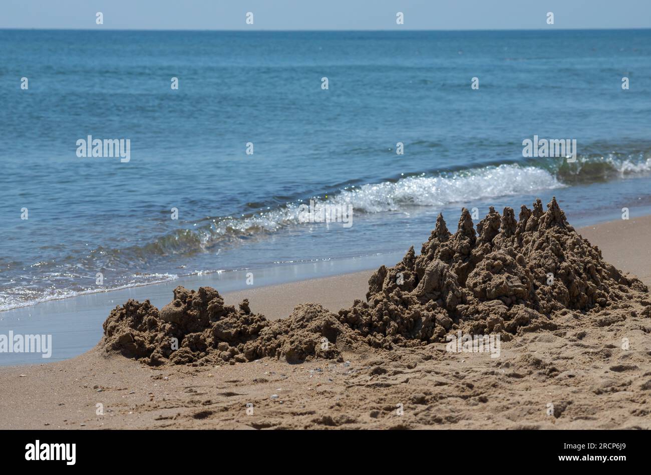 sand castle on the beach near the water. High quality photo Stock Photo ...