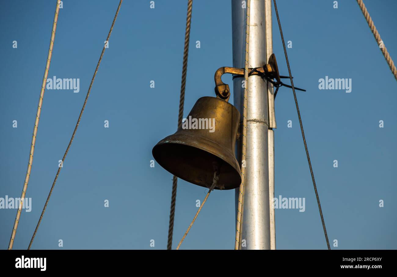 Large ship's bell with large clapper on a cruise ship at blue sky Stock ...