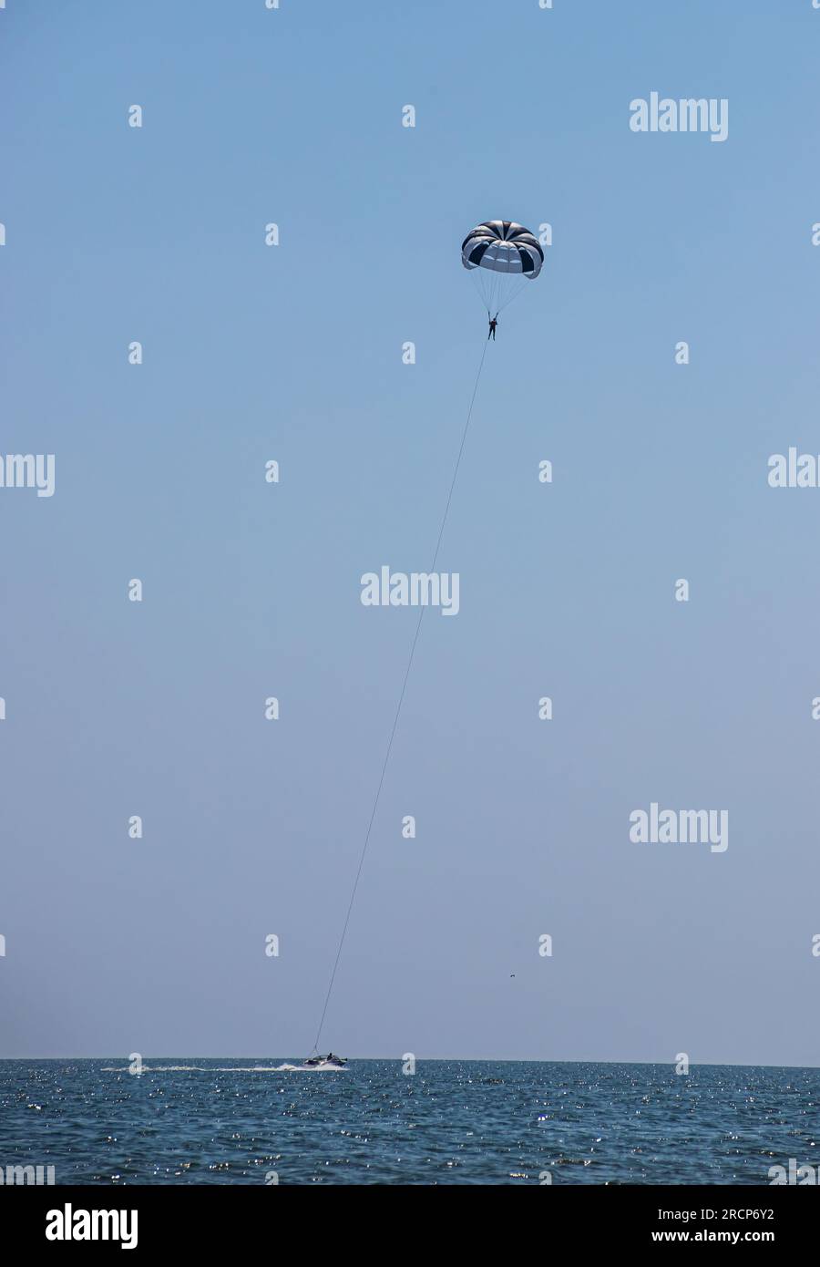 Parasailing is a popular type of outdoor activity at the sea. Parachute ...