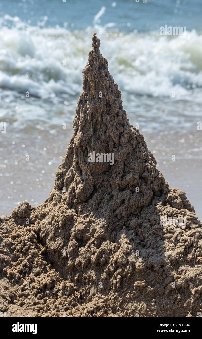 sand castle on the beach near the water. High quality photo Stock Photo ...