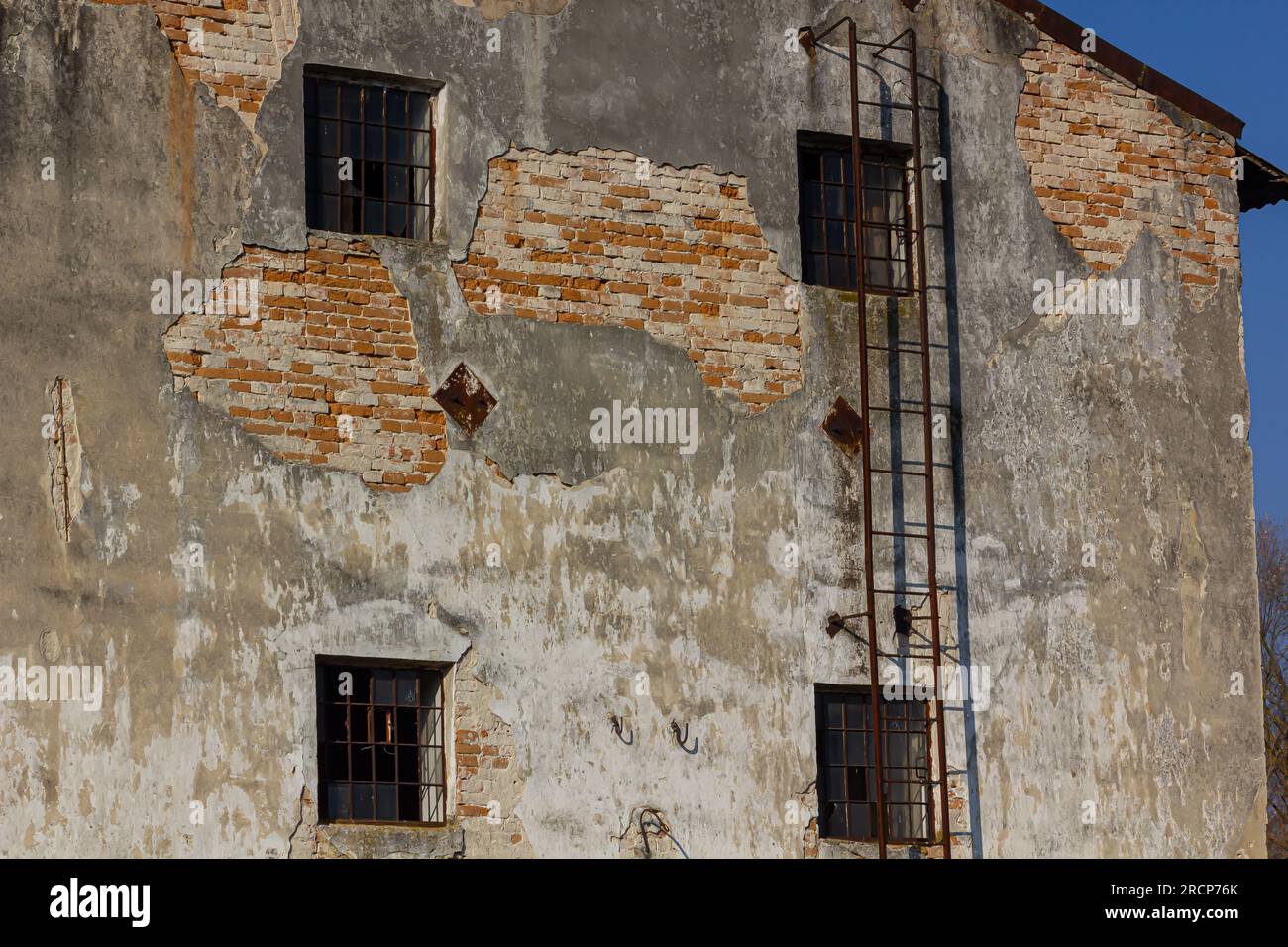 Exterior of old brick building with rusted fire escape Stock Photo - Alamy