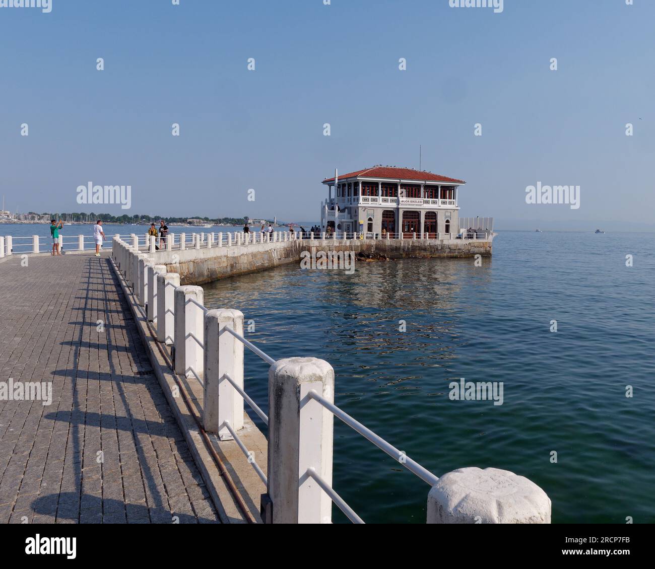 people on a jetty in the Kadikoy neighbourhood on the Asian side of ...