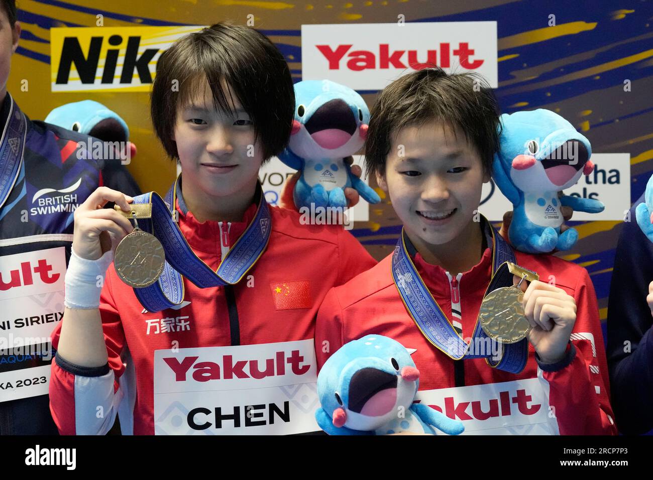 Chen Yuxi and Quan Hongchan of China celebrate with their gold medals ...