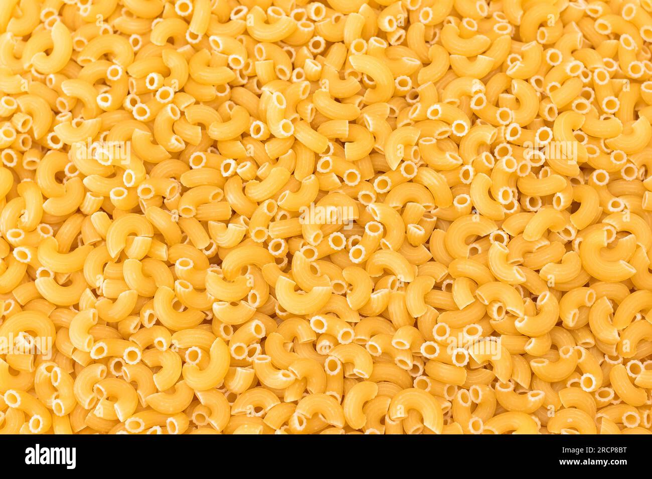 Uncooked Chifferi Rigati Pasta Background. Fat and Unhealthy Food ...