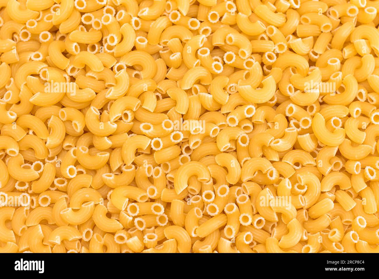 Uncooked Chifferi Rigati Pasta Background. Fat and Unhealthy Food ...