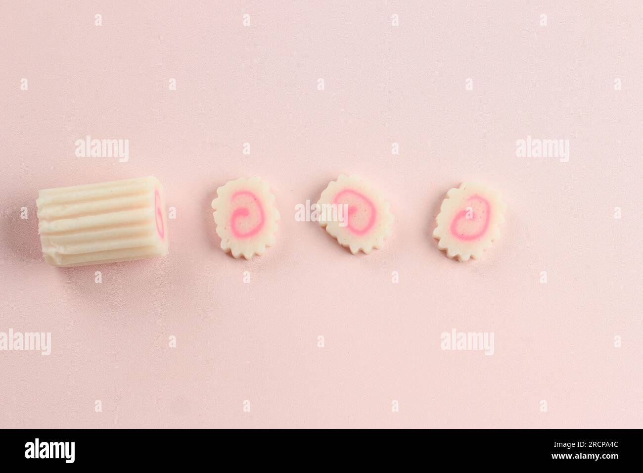 Kamaboko Narutomaki Surimi Steamed Fish Cake on Pink Table. Top View ...